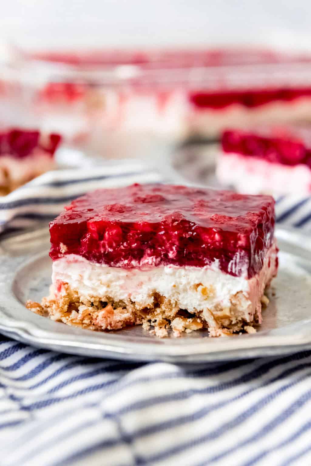 Easy Raspberry Pretzel Salad Recipe - House of Nash Eats